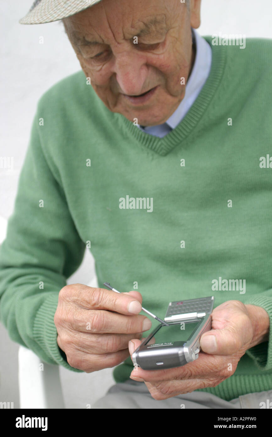old man with mobile phone / PDA Stock Photo - Alamy