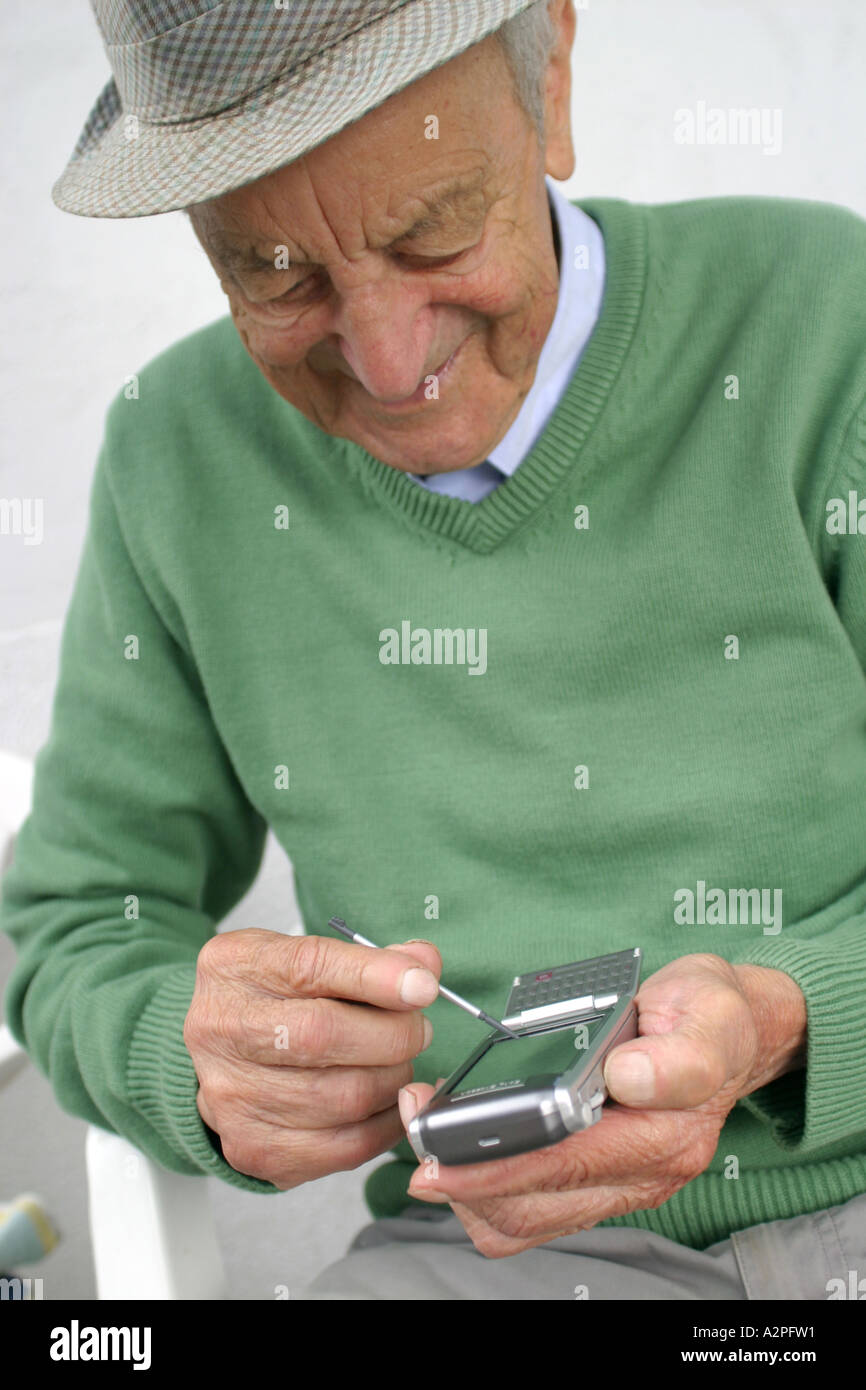 old man with mobile phone / PDA Stock Photo - Alamy