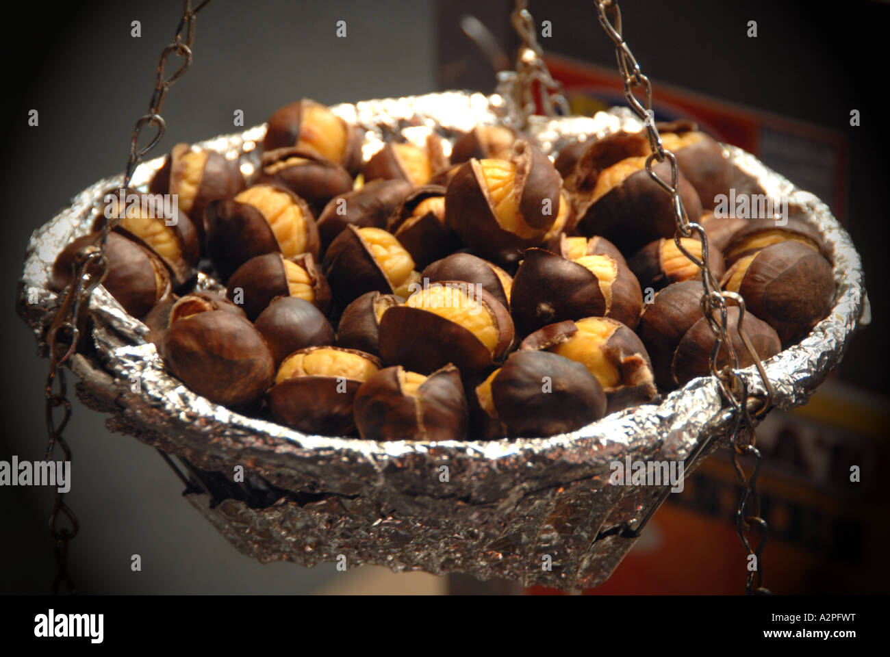 Roasted chestnuts displayed on an outdoor New York City food cart Stock ...