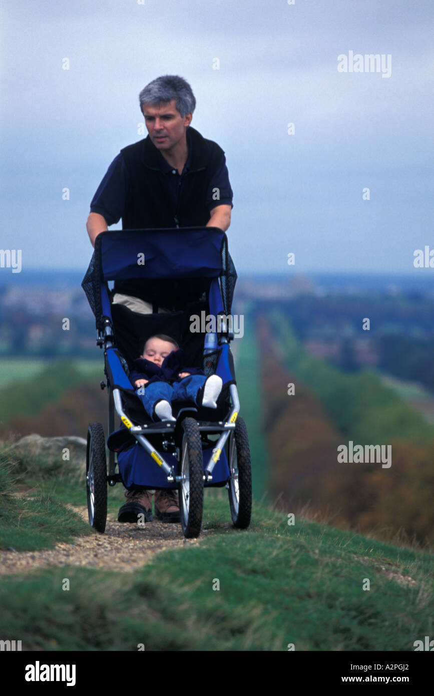 Man pushing baby in offroad pushchair Stock Photo - Alamy