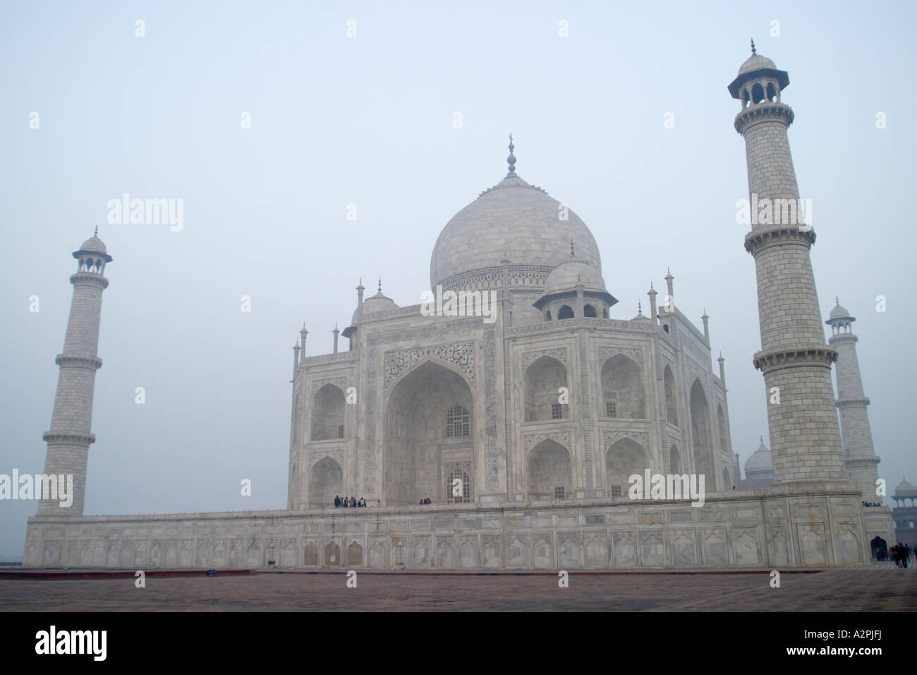 The Taj Mahal sits amimdst a cool fog as evening comes. Horizontal ...