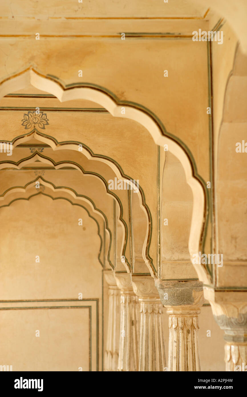 columns and arches in an ancient palace, india. Vertical Stock Photo ...