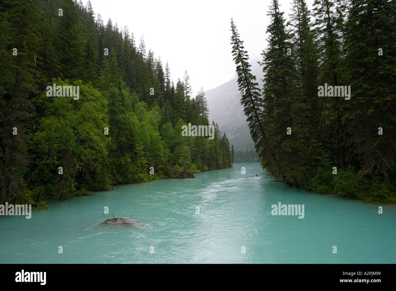 Water from Lake Robson at the base of Mt. Robson flows through the ...