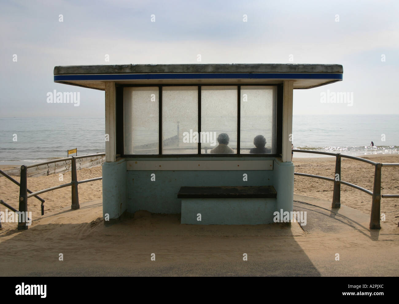 Old people sitting beach hut hi-res stock photography and images - Alamy
