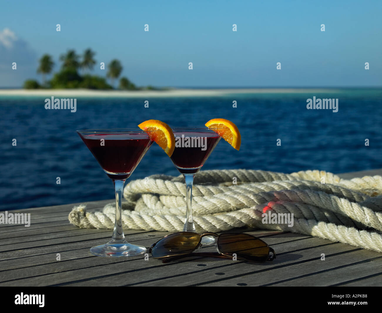 Cocktails on board a boat moored off a tropical island in South Ari ...
