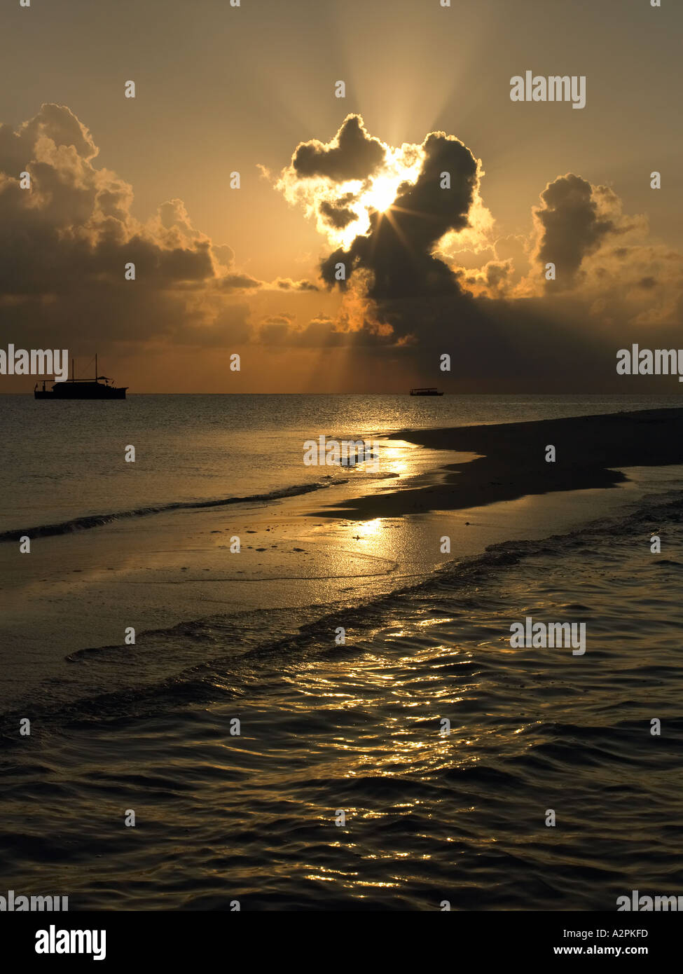 Dramatic sunset over a remote sandbar in South Ari Atoll in the ...