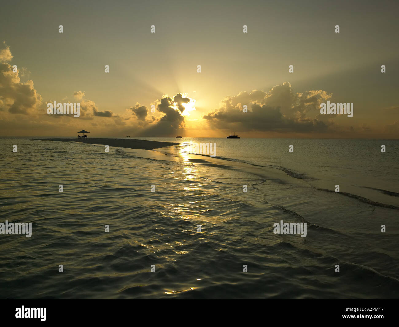 Sunset over a tropical lagoon in South Ari Atoll in the Maldives Stock ...