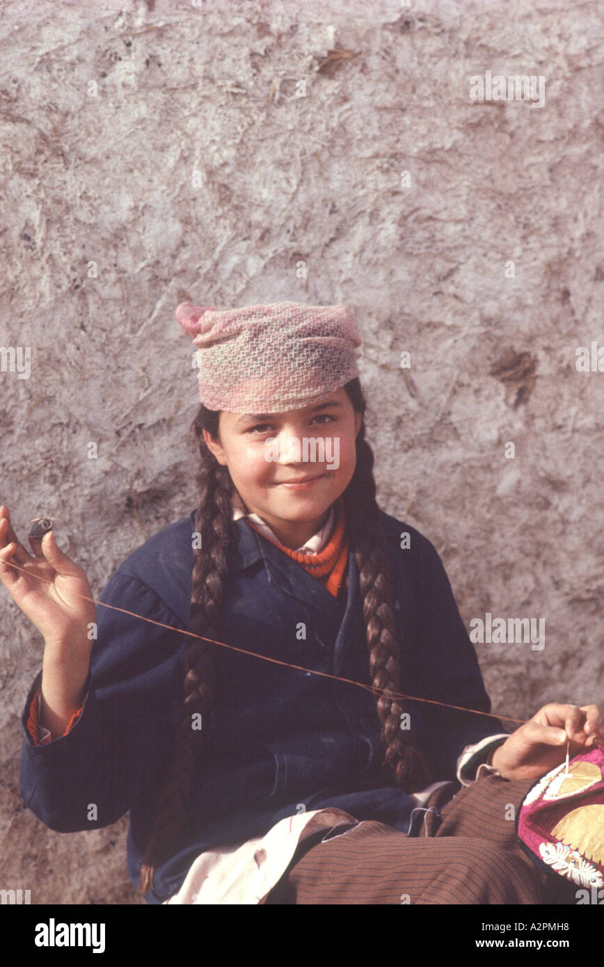 Western China Kashgar Yugur girl embroidering Stock Photo - Alamy