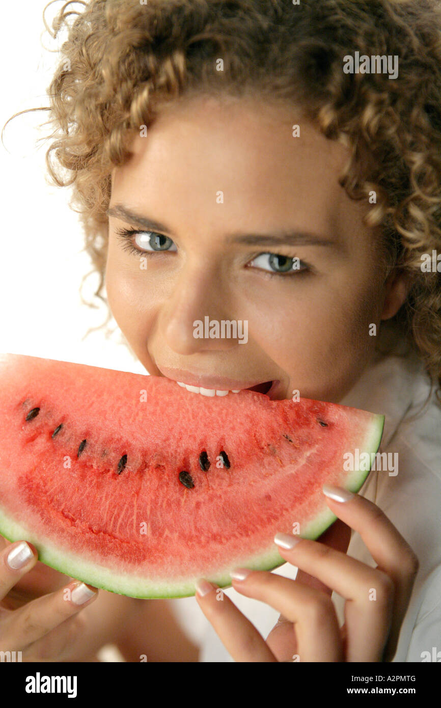Woman eating watermelon Stock Photo - Alamy