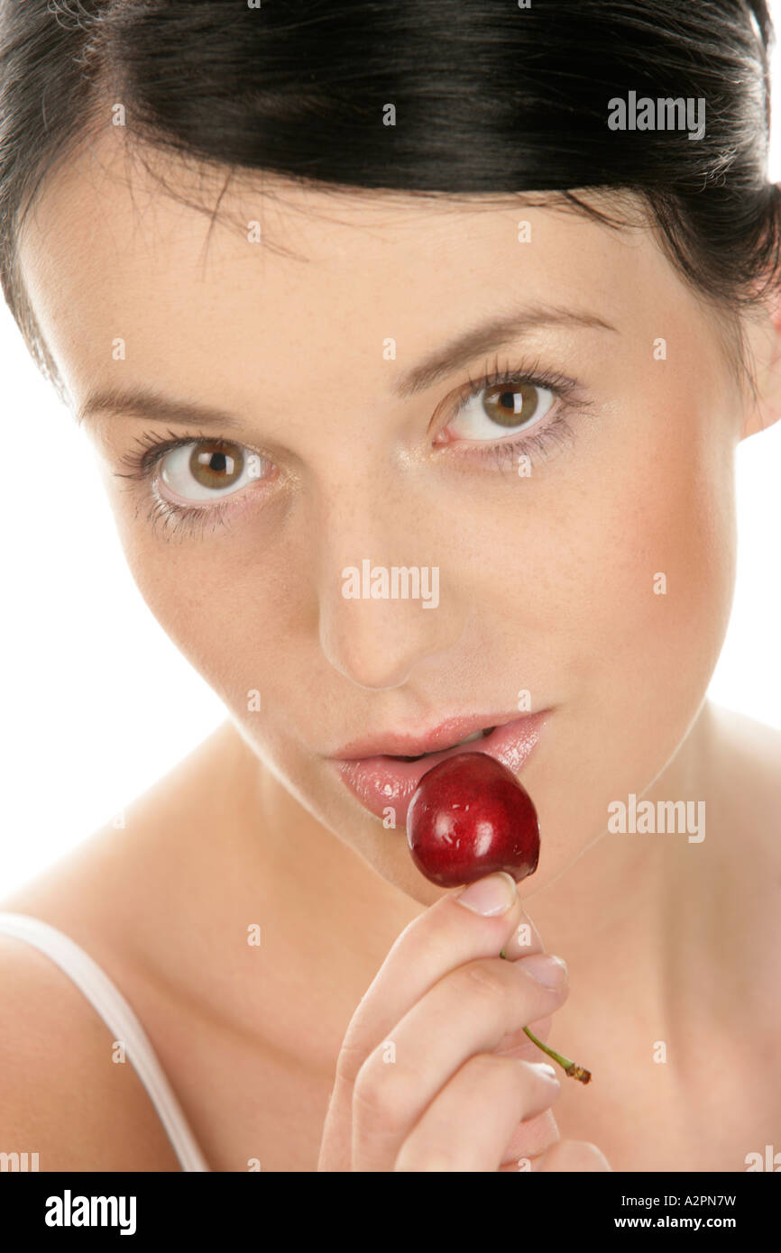 Woman alone eating cherries hi-res stock photography and images - Alamy