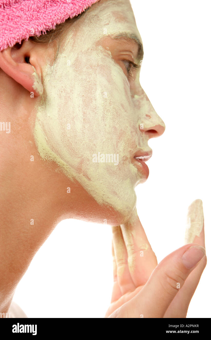 Woman applying mask Stock Photo - Alamy