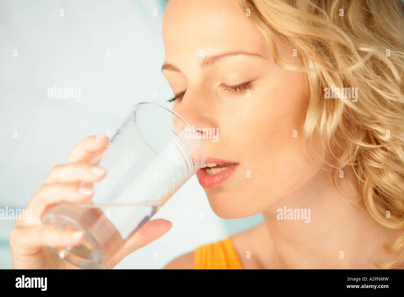 Woman drinking water Stock Photo - Alamy