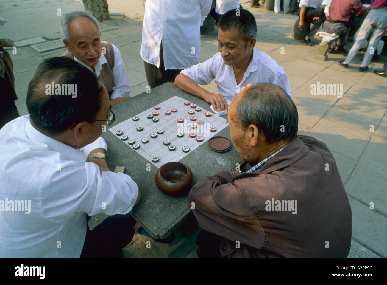 Chinese men playing mahjong hi-res stock photography and images - Alamy