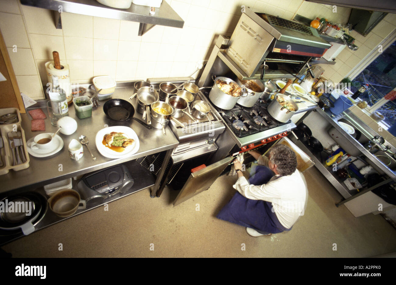 Shaun Hill, chef, works in his one man kitchen at The Merchant House ...