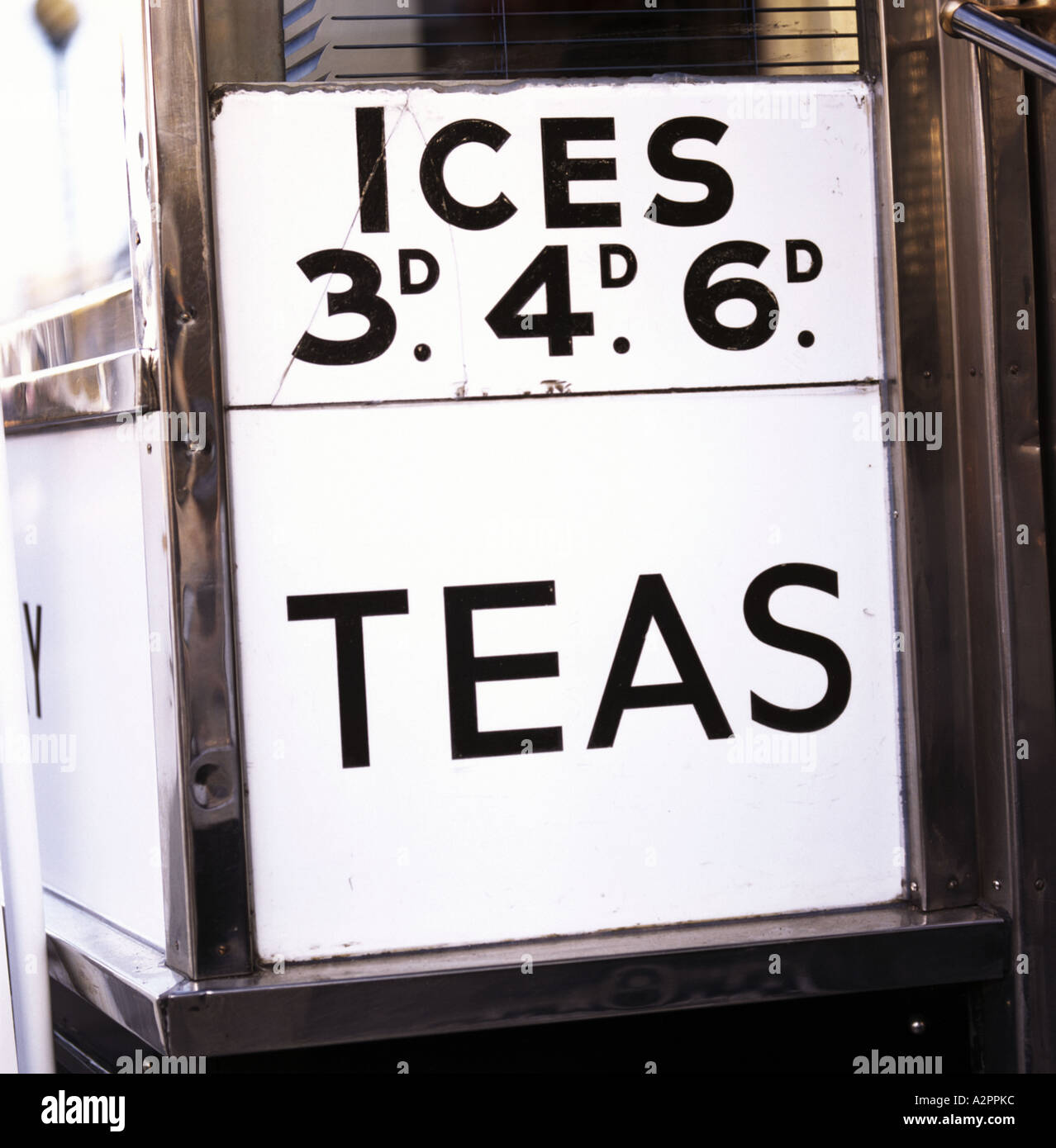an old fashioned sign outside a cafe for ices and teas in London Stock ...
