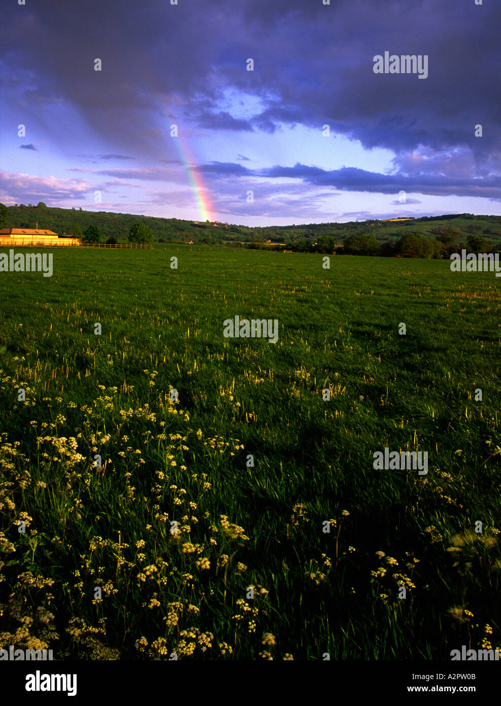 Rainbow over farmland in the Cotswolds Gloucestershire England UK Stock ...