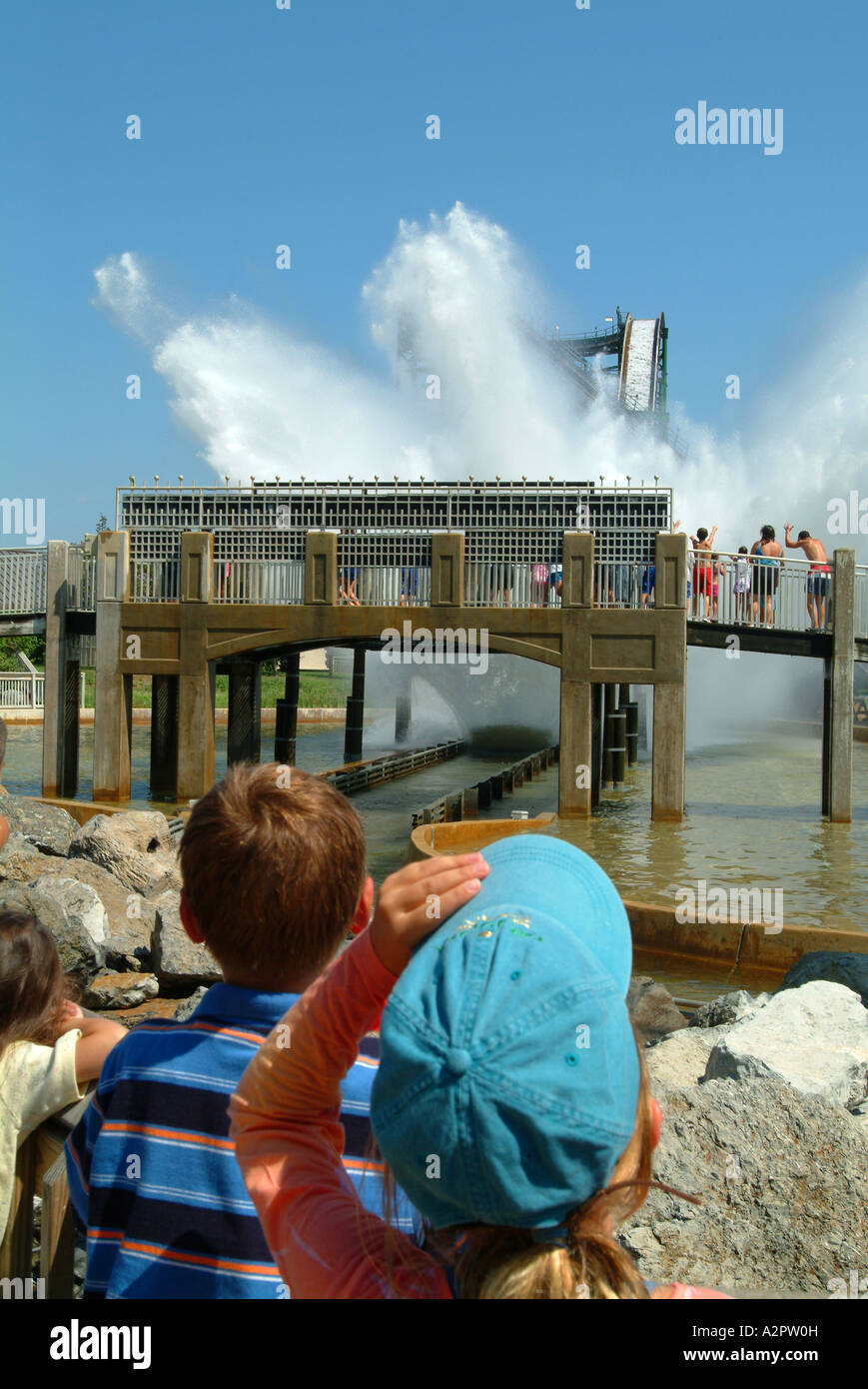 Kids watch water spray up from a ride called Tidal Force Stock Photo ...
