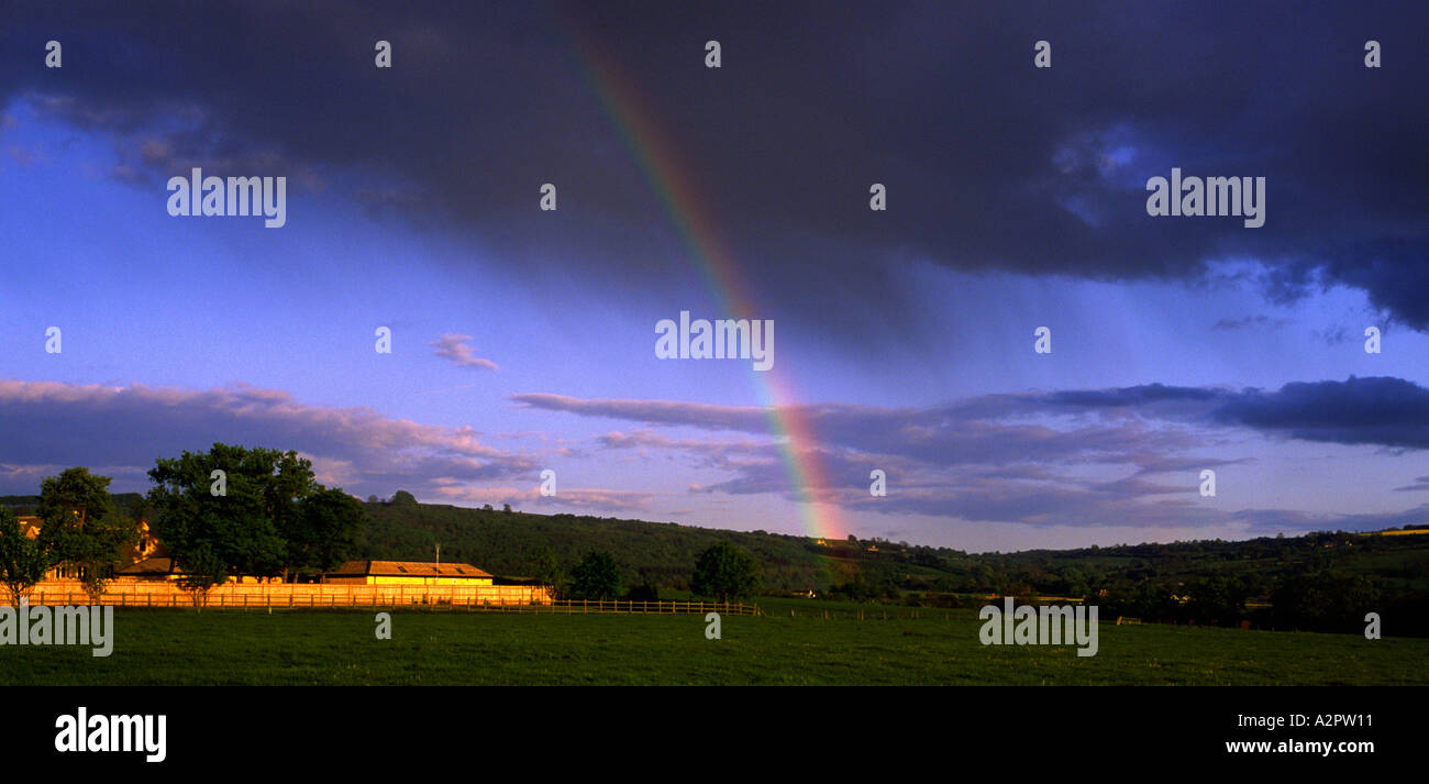 Rainbow over farmland in the Cotswolds Gloucestershire England UK Stock ...