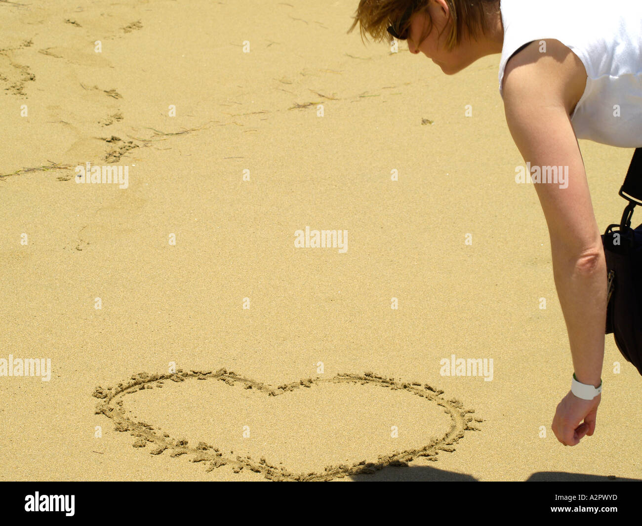 Woman painting in sand hi-res stock photography and images - Alamy
