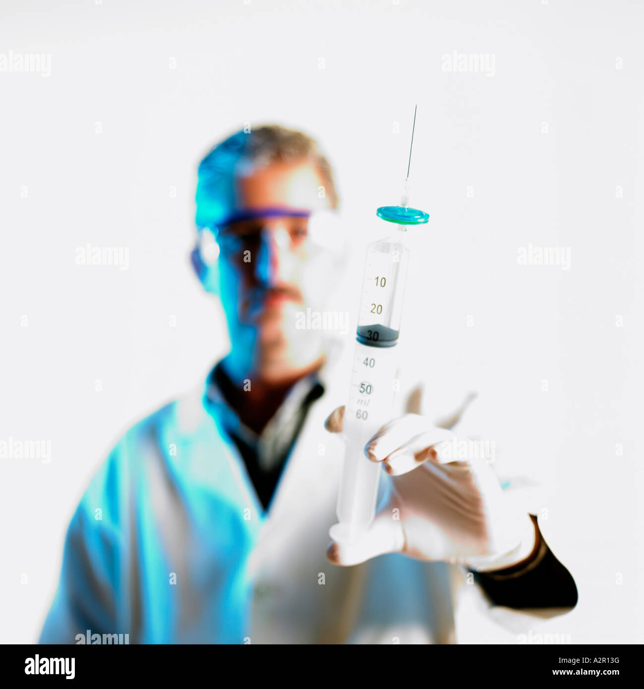 Man with Syringe lit by Blue Gel Stock Photo - Alamy