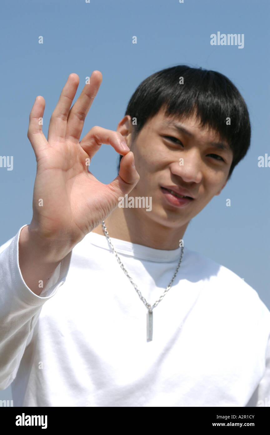 Asian hand sign hi-res stock photography and images - Alamy