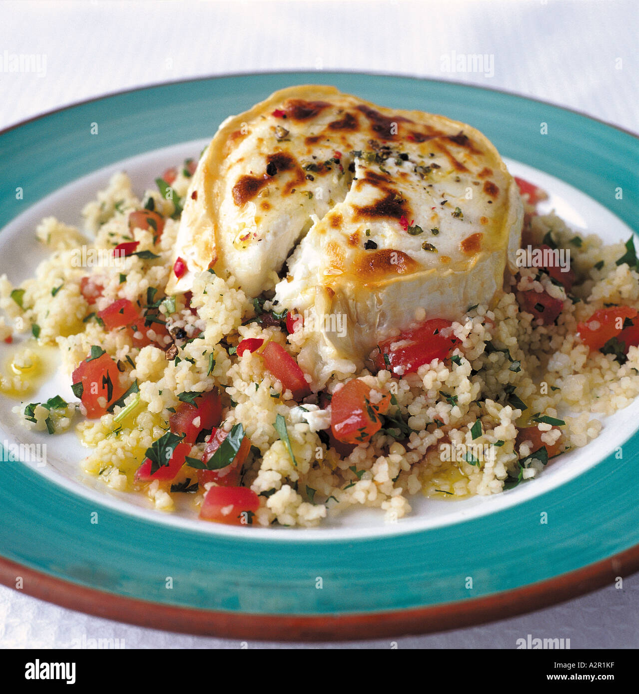 Grilled Goats Cheese on a bed of Cous Cous Stock Photo - Alamy