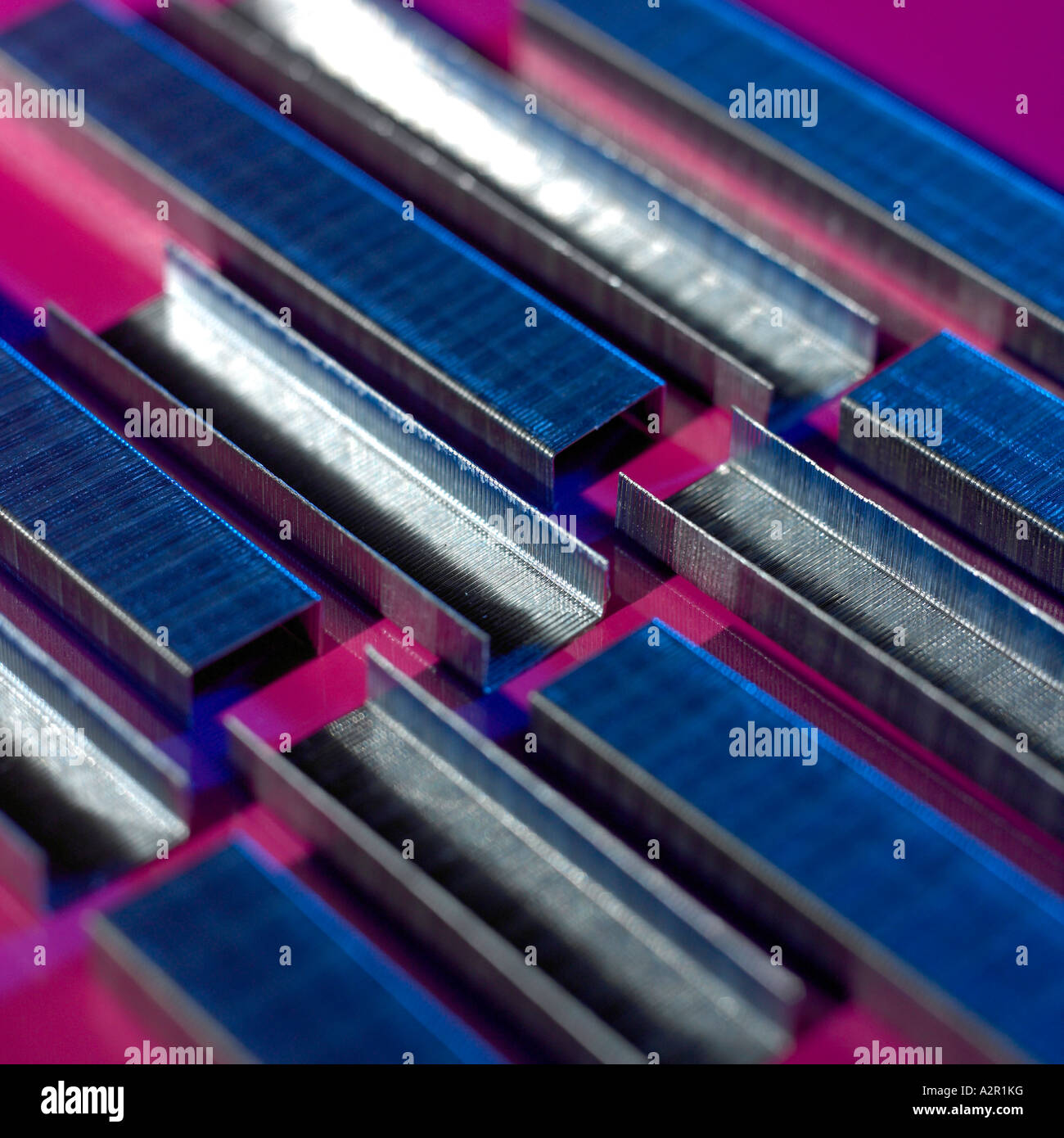 Staples on Purple background with Blue Gel Stock Photo - Alamy