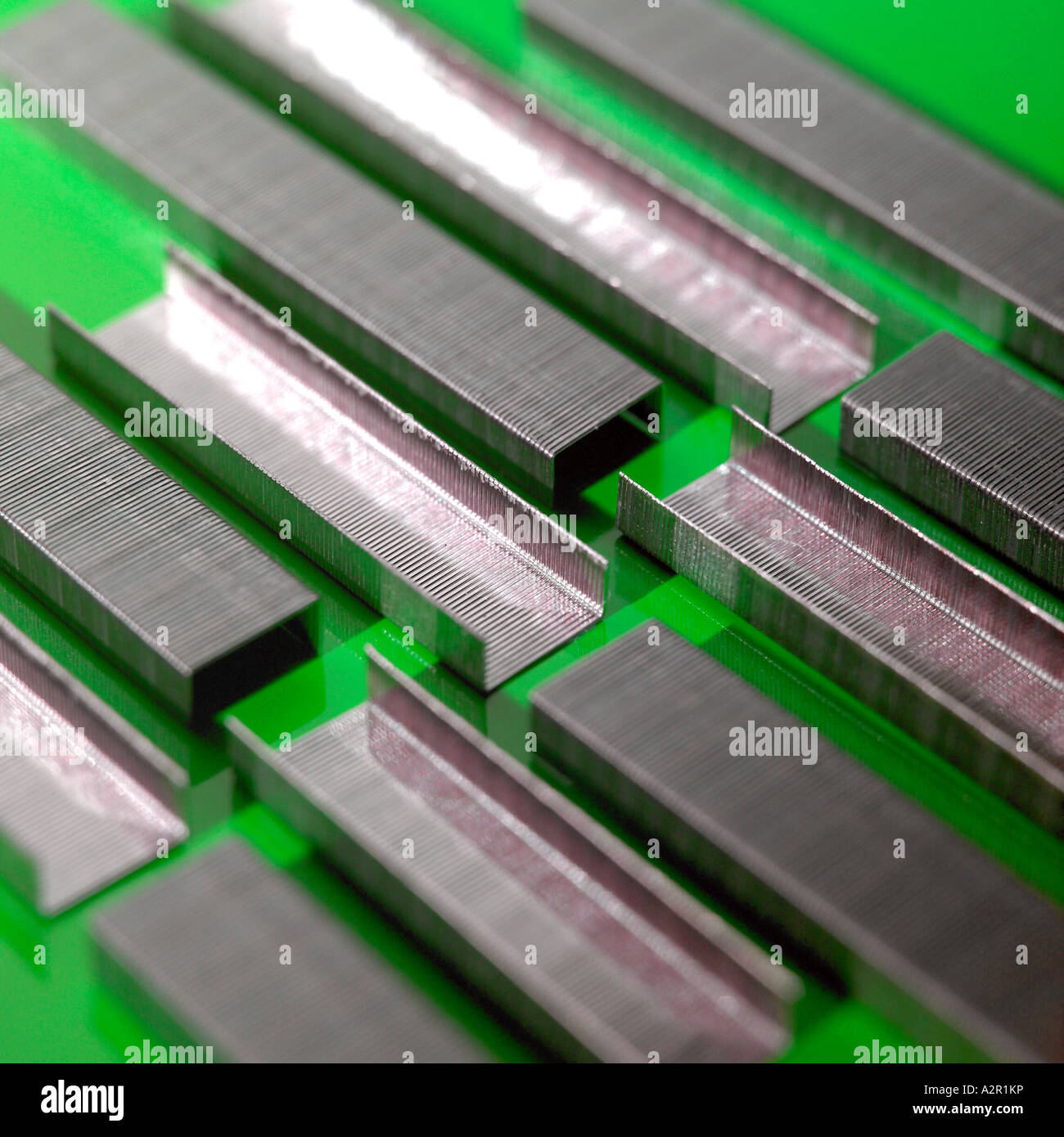 Staples on Green background Stock Photo - Alamy