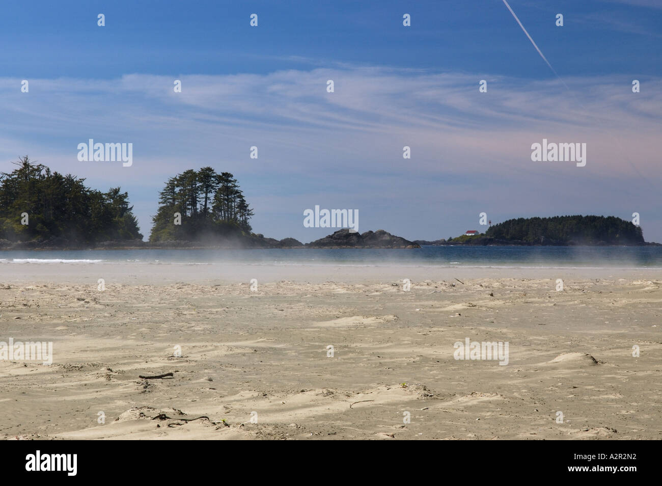 Frank Island and lighthouse Chesterman Beach Stock Photo - Alamy
