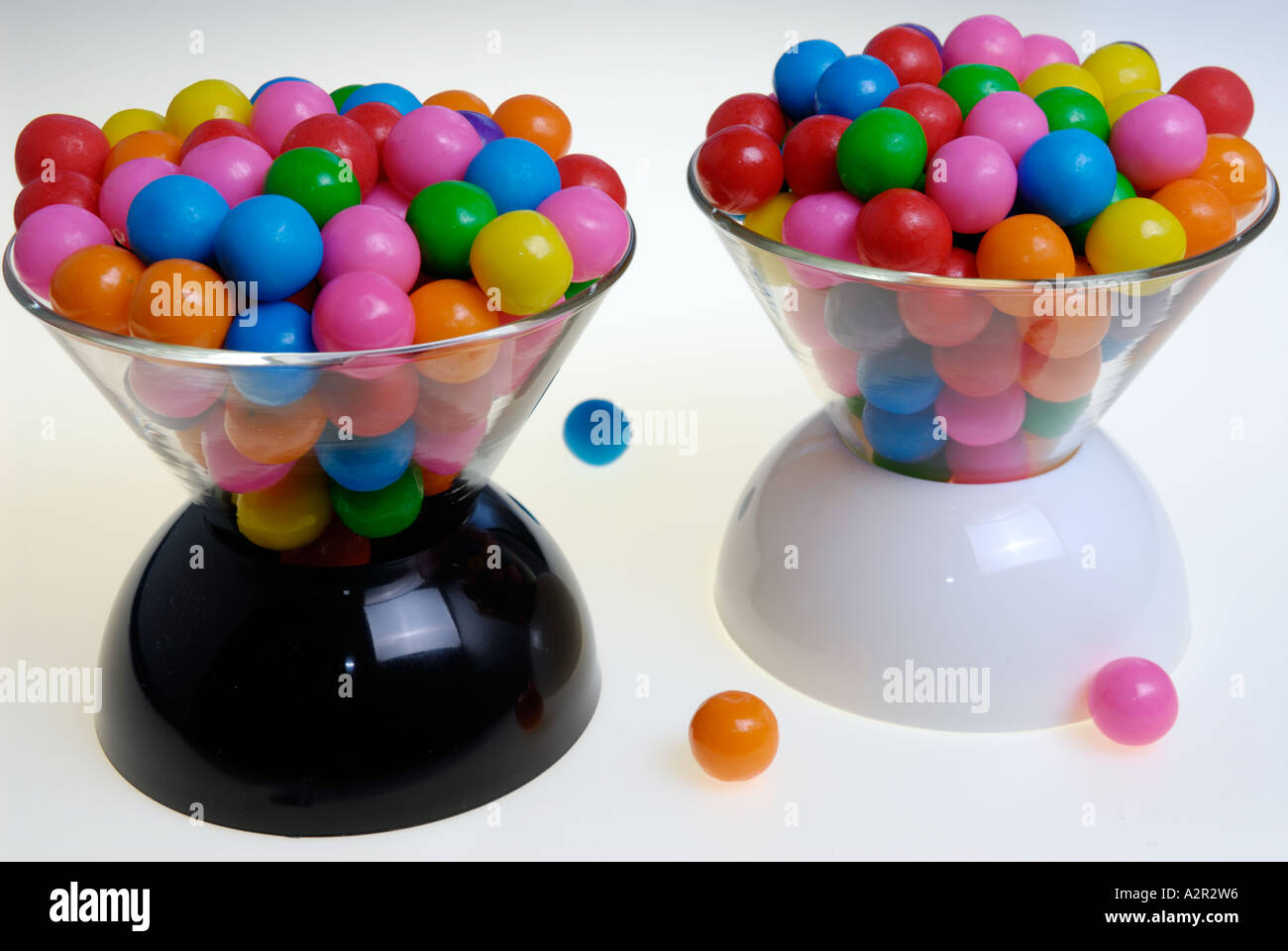 Two cups of colorful balls of chewing gum candy Stock Photo - Alamy