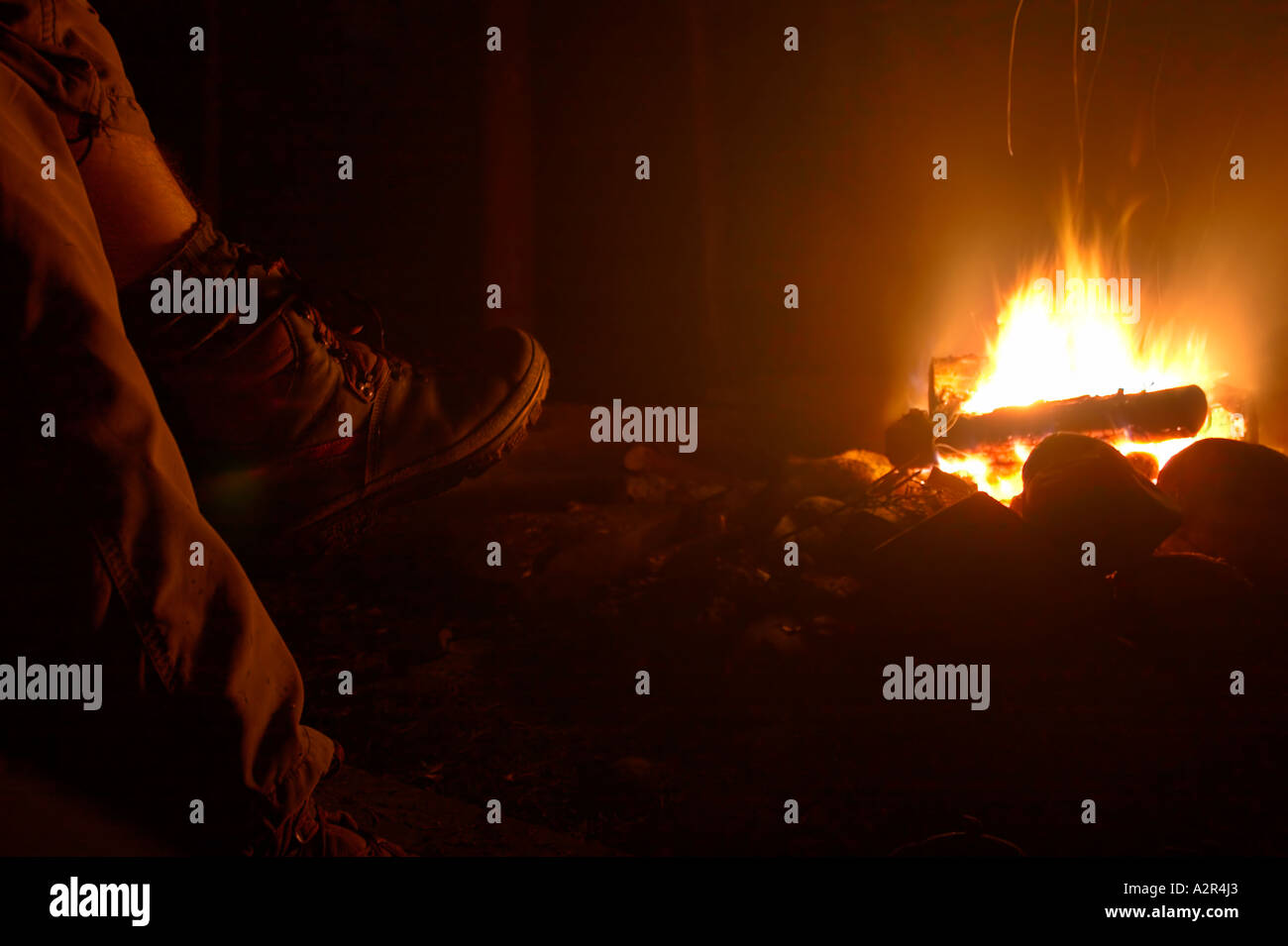 Person resting near a campfire in Oulanka National Park, Kuusamo ...