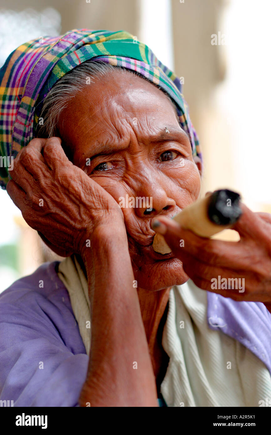 old lady smoking in myanmar Stock Photo - Alamy