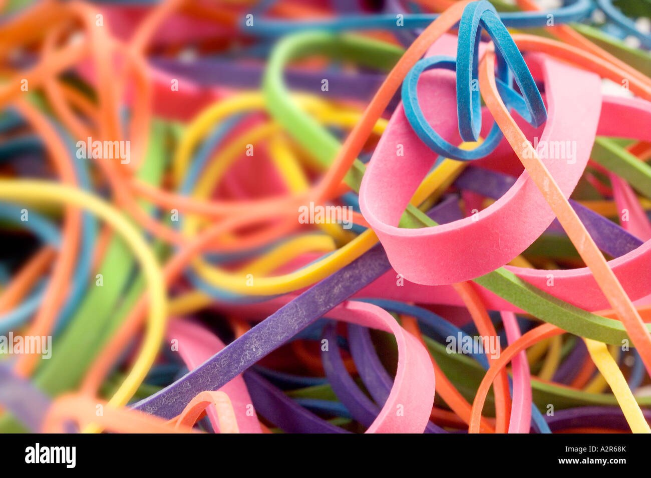 multi coloured elastic bands office abstract background close up Stock ...