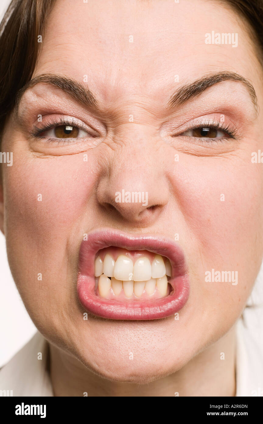 Female gritted teeth hi-res stock photography and images - Alamy