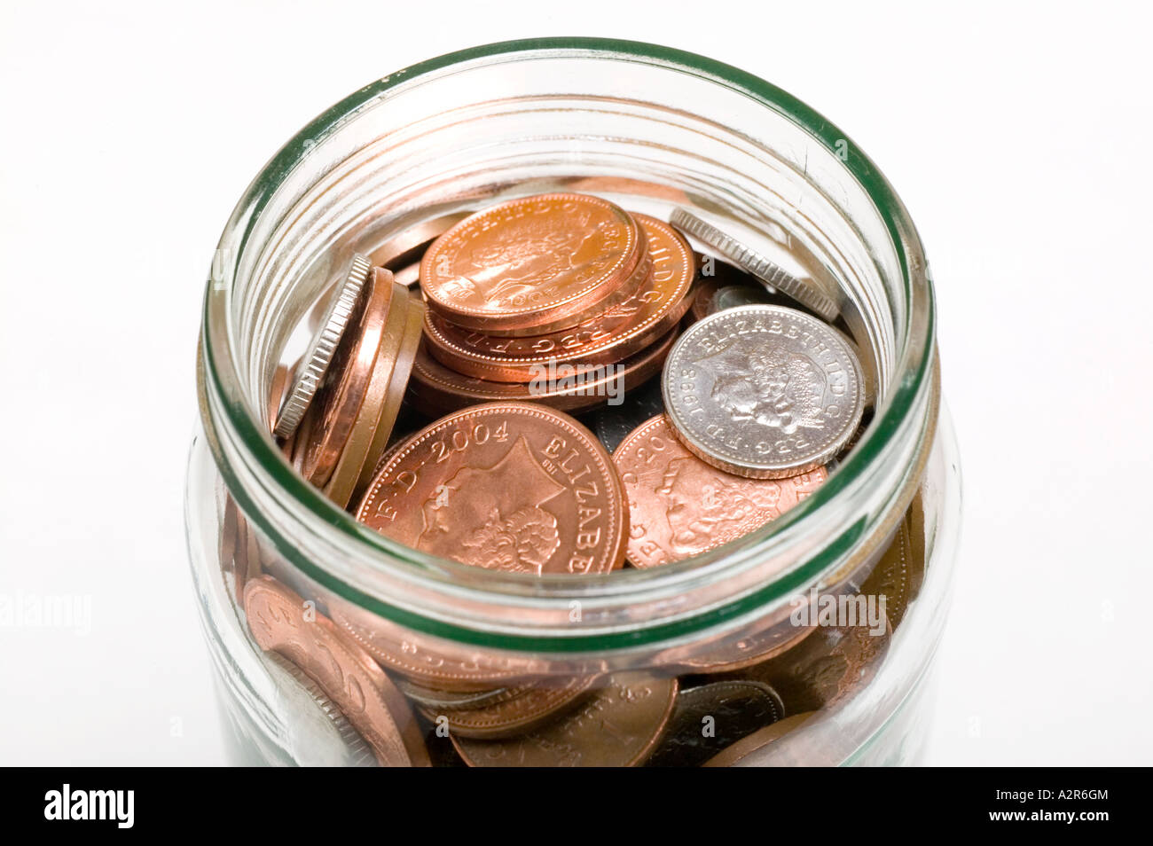 Glass jam jar filled with loose change Stock Photo - Alamy