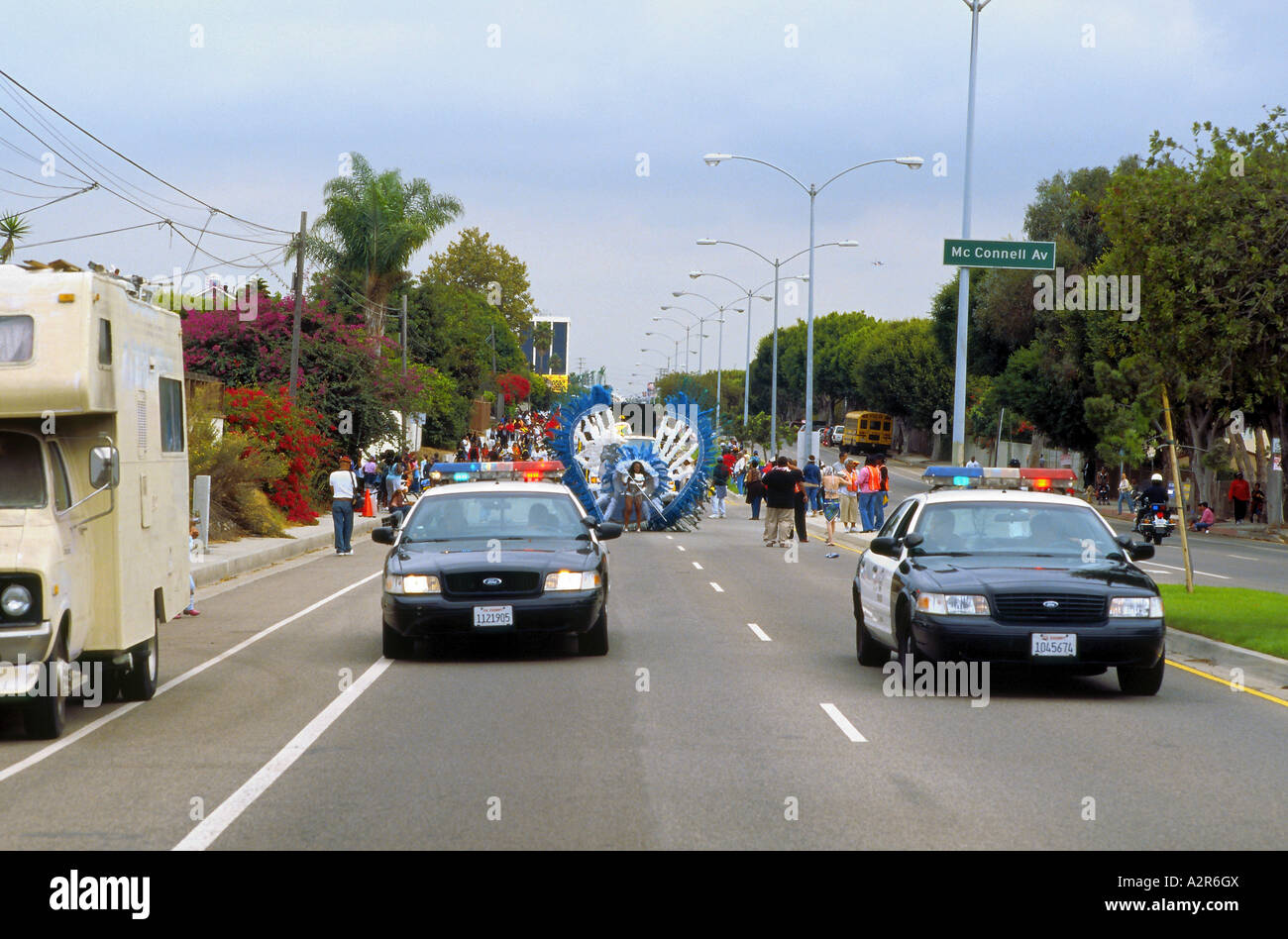Two police cars leading the parade along Manchester Avenue to ...