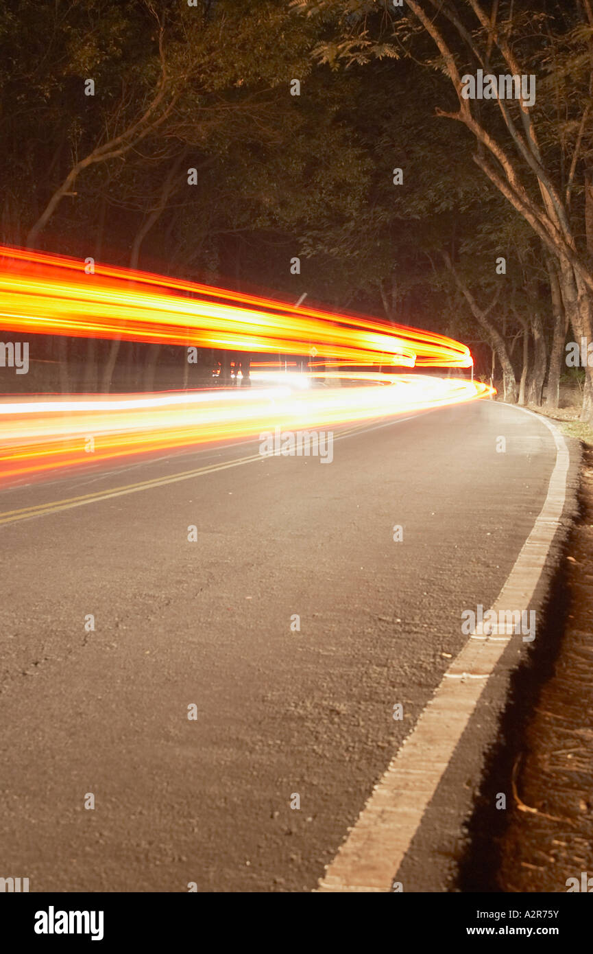 Traffic With Light Trails On Country Road Stock Photo - Alamy