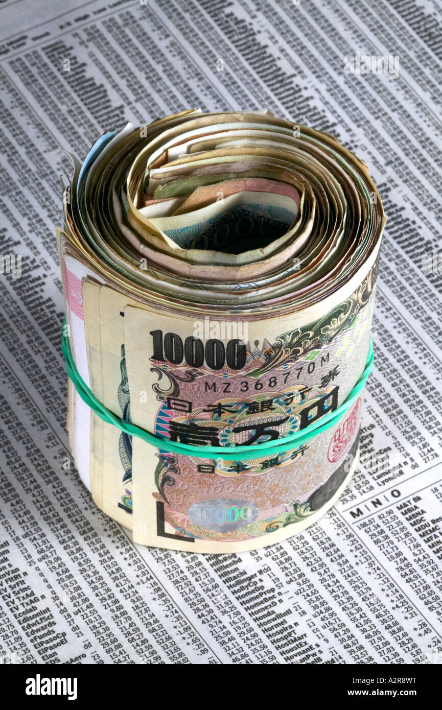 roll of international currency with japanese yen note outer secured ...
