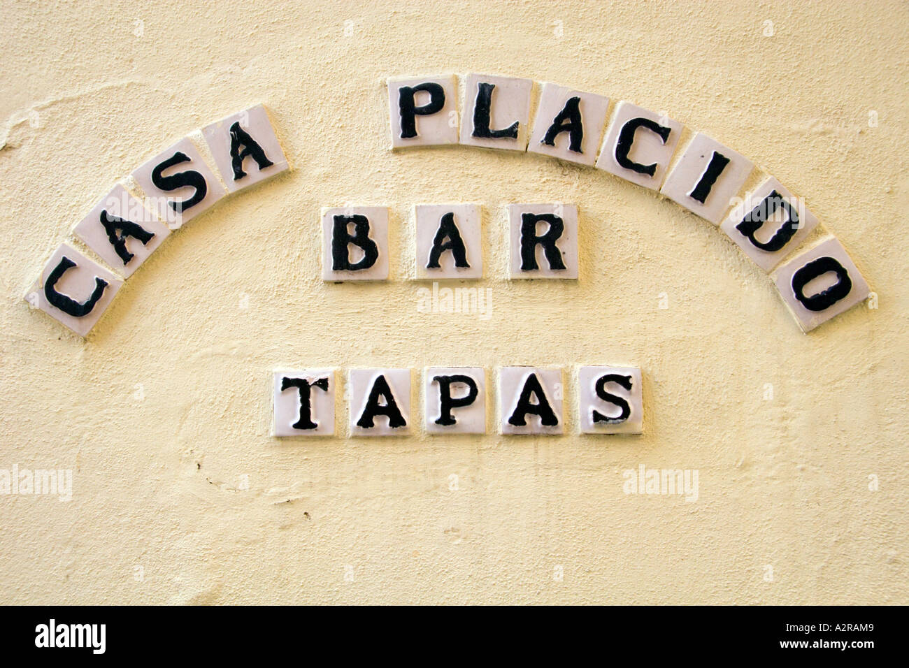 Casa Placido Tapas bar sign on the street wall Stock Photo - Alamy