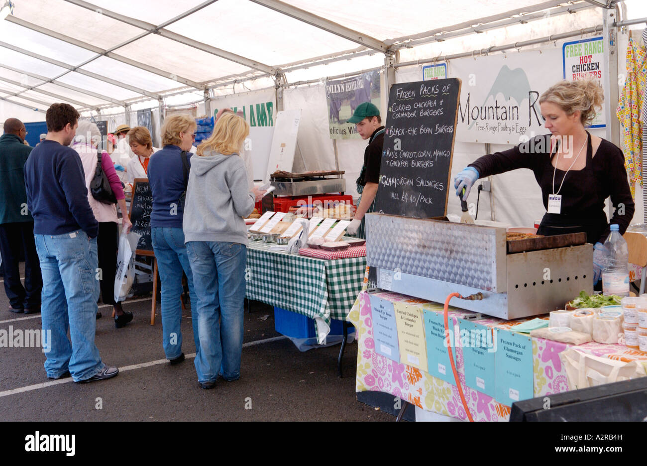 Fast food marquee of Cowbridge Food Festival with people browsing ...