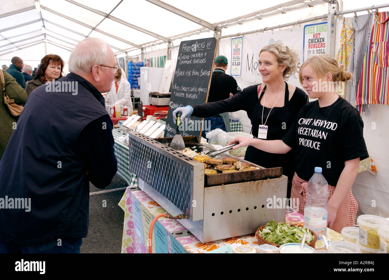 Fast food marquee of Cowbridge Food Festival with people browsing ...