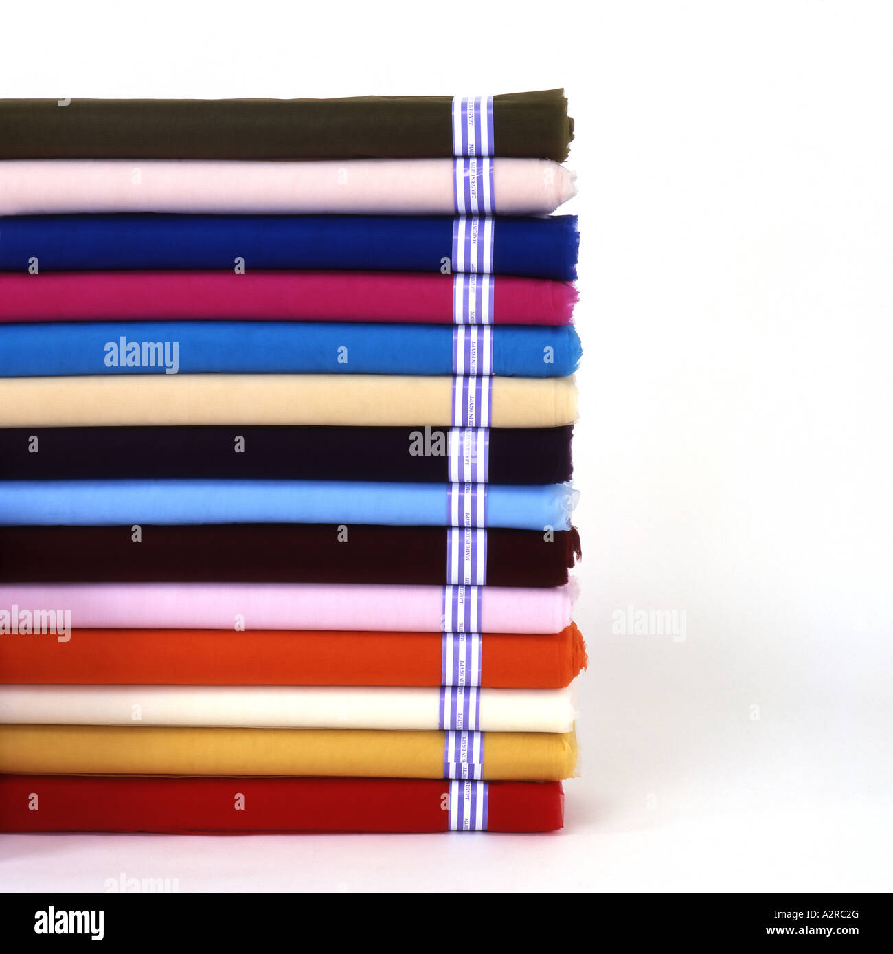 Rolls of fabric on white background Stock Photo - Alamy