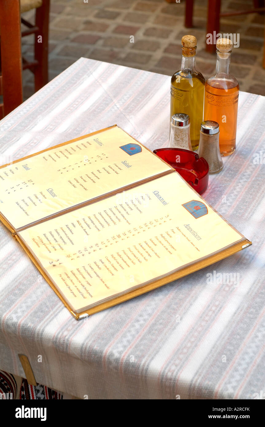 Menu opened on restaurant table Stock Photo - Alamy