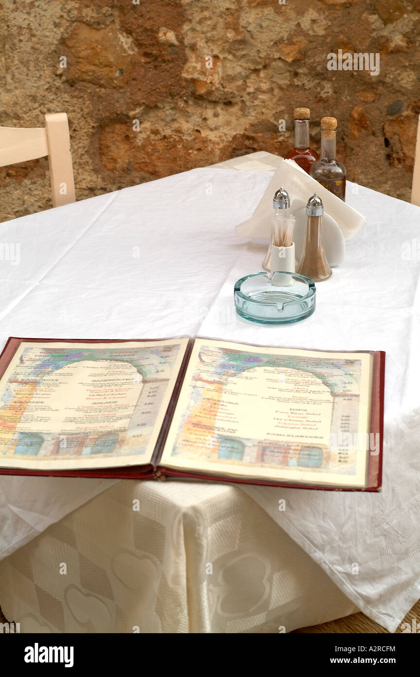 Menu opened on restaurant table Stock Photo - Alamy