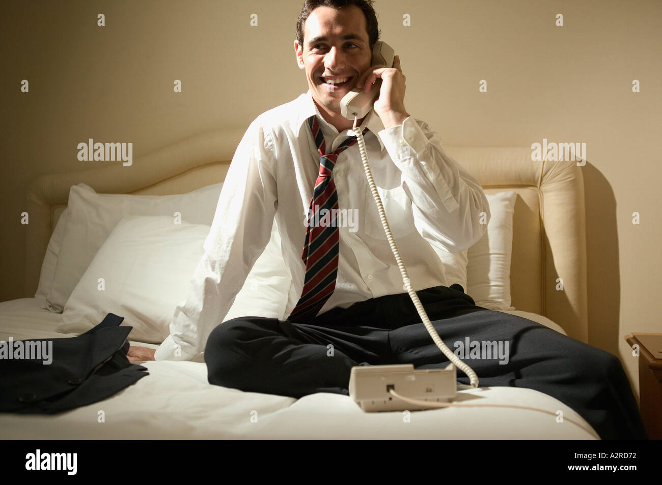 Businessman using telephone Stock Photo - Alamy