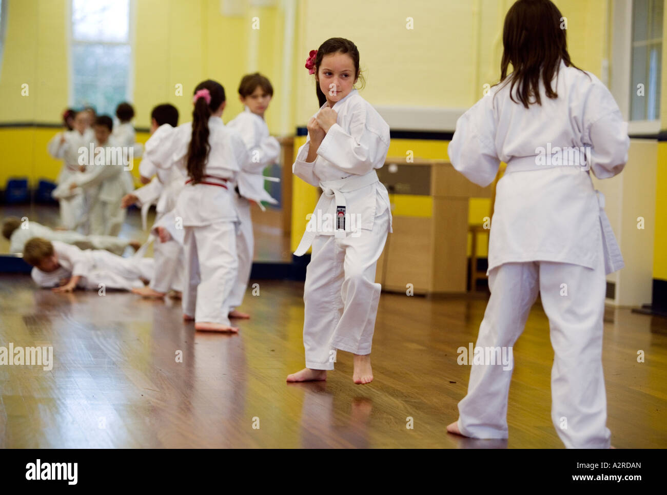 A karate class at a primary school in Wolverhampton UK. The class is ...