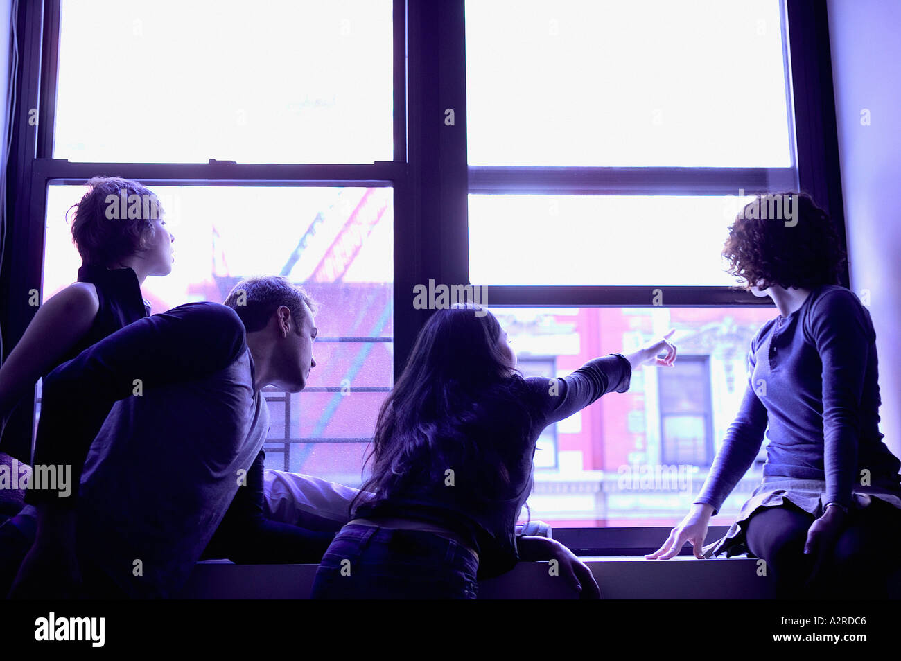 Silhouetted people at window Stock Photo - Alamy