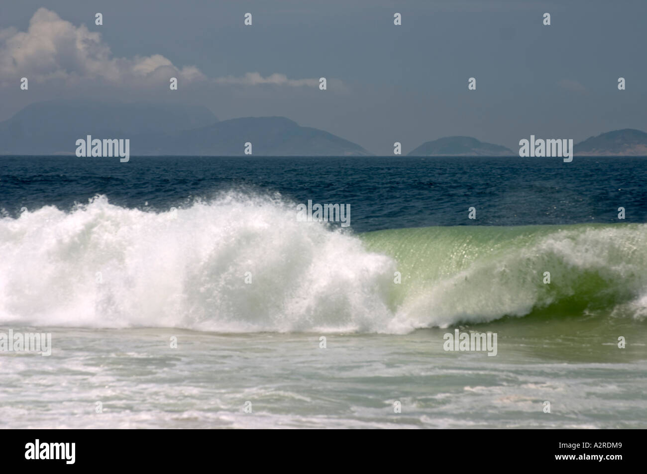 Rolling breaking wave with surf and foam Copacabana beach Rio de ...