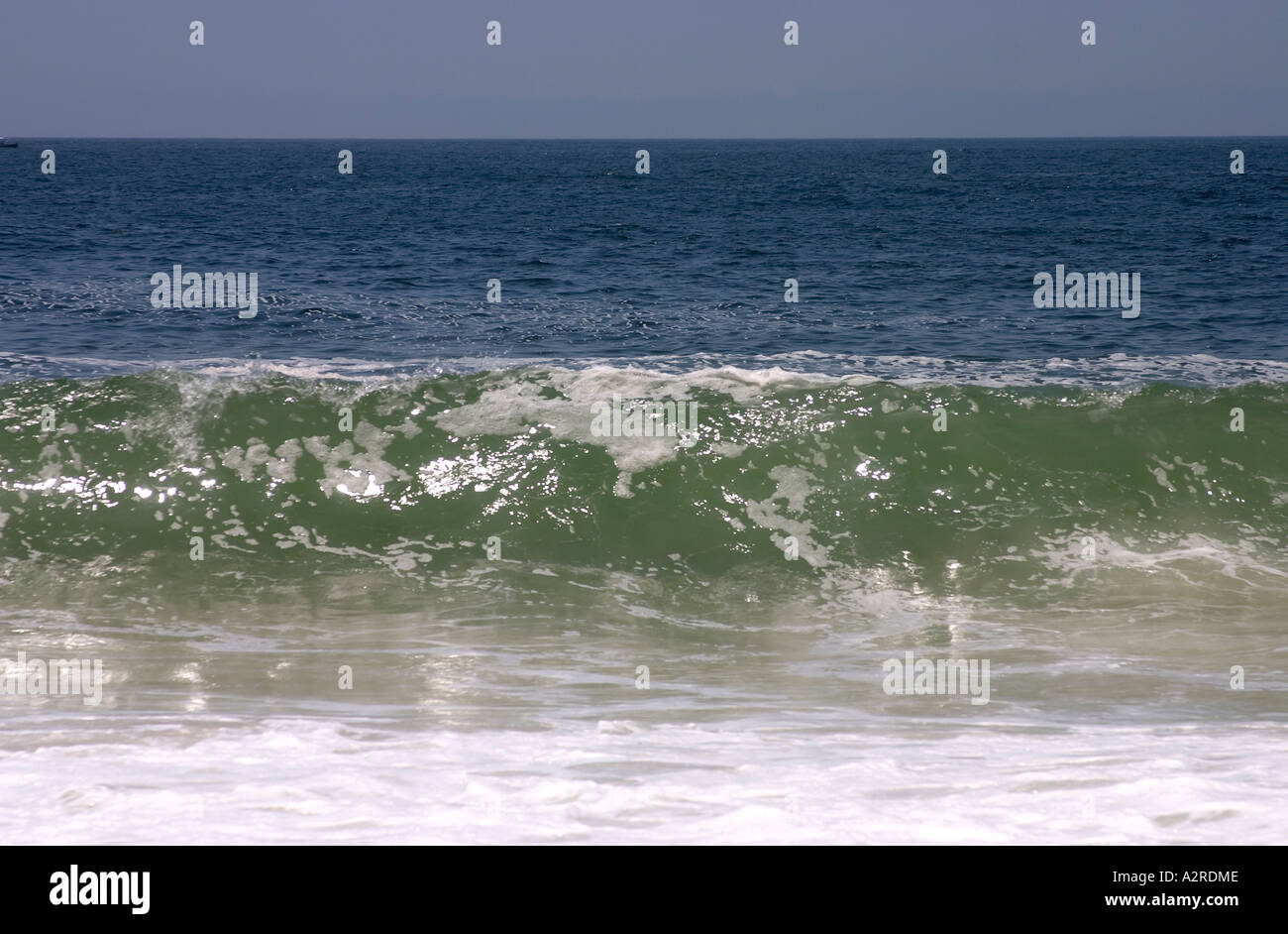 Rolling wave with surf and foam Copacabana beach Rio de Janeiro Brazil ...