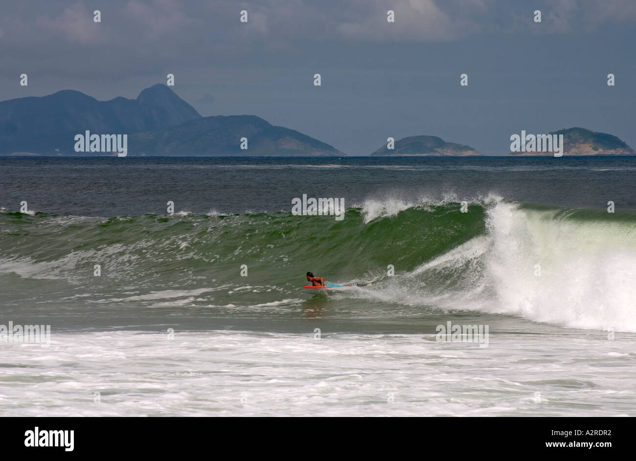 A Surfer Surfing on rolling surf wave Copacabana beach Rio de Janeiro ...